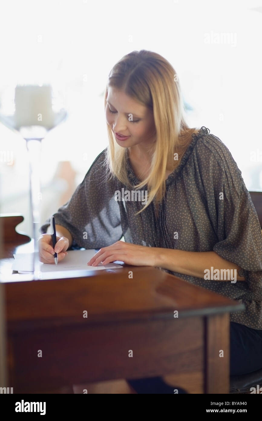 Girl writing a letter Stock Photo - Alamy