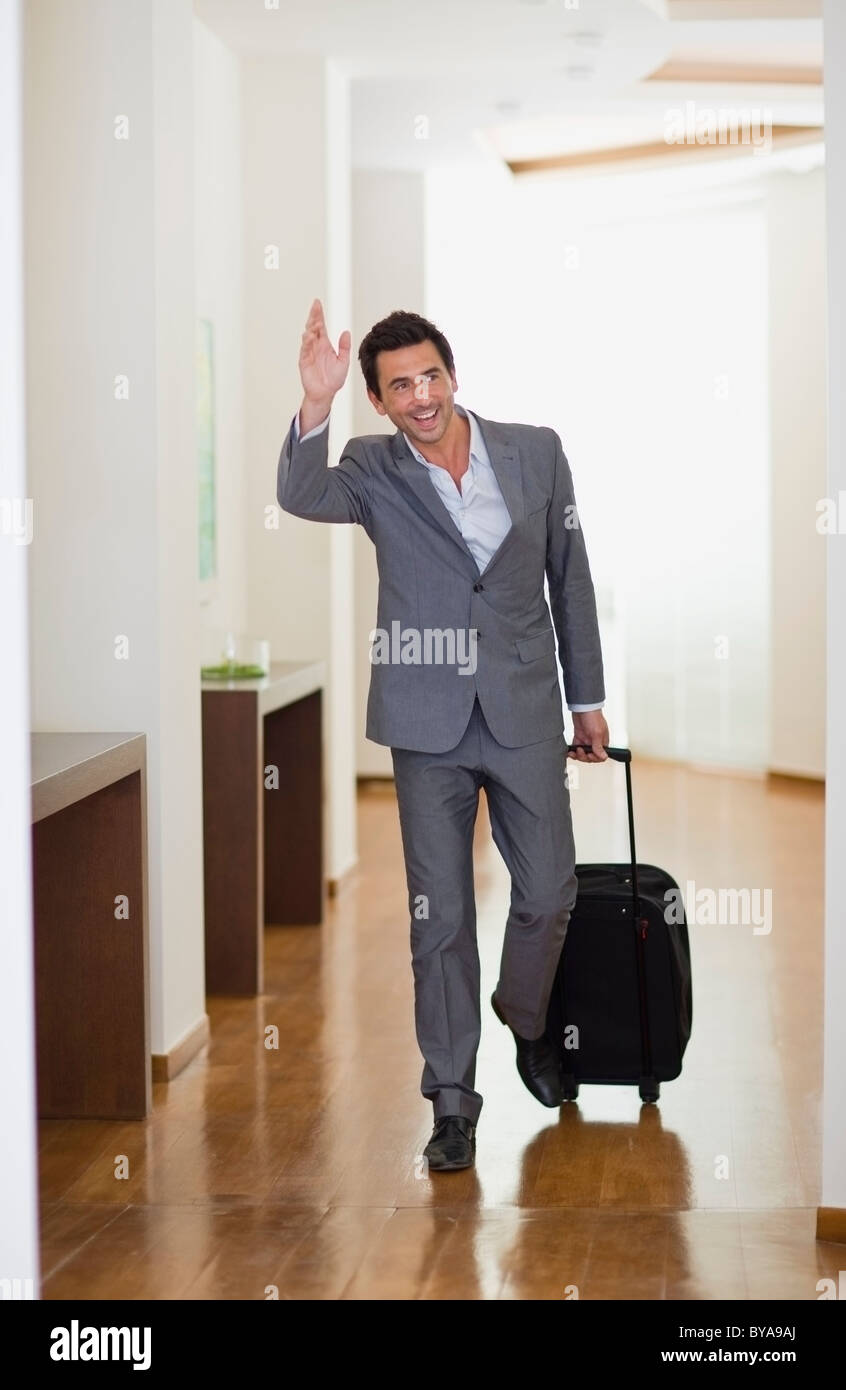 Man arriving at hotel Stock Photo - Alamy
