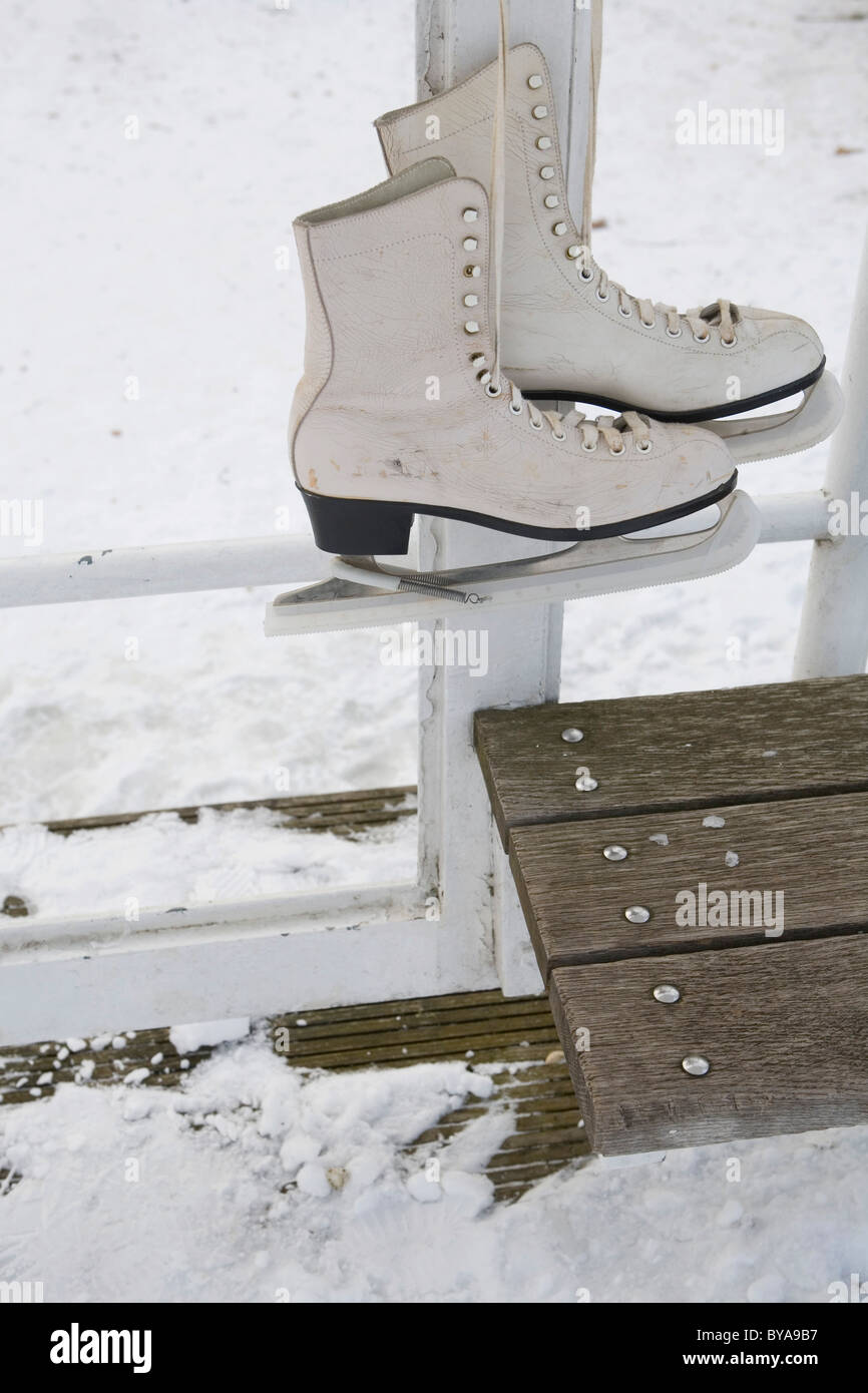 Old ice skates on a bench beside the frozen Alster Lake, Hamburg ...