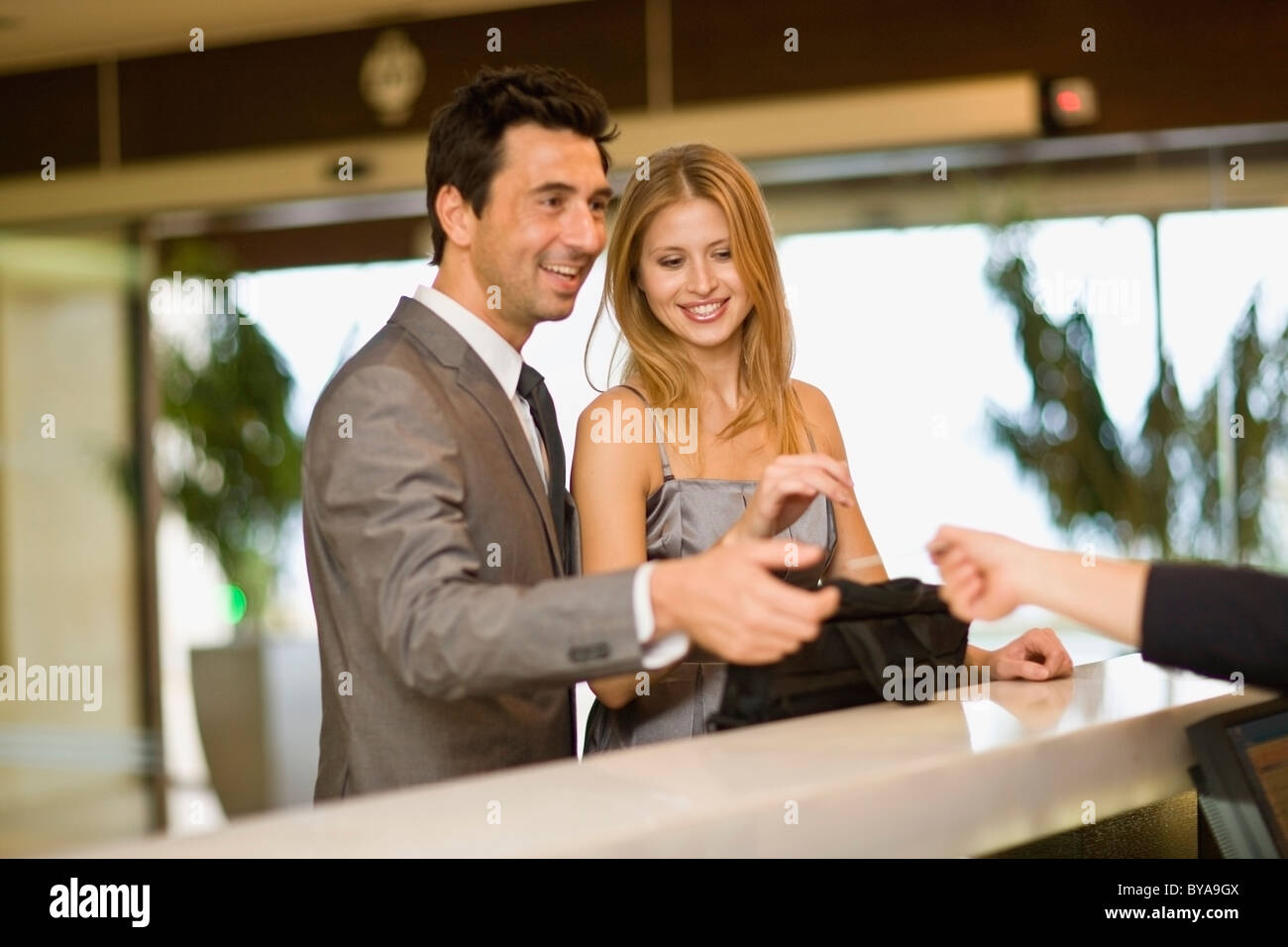 Couple checking in Stock Photo - Alamy