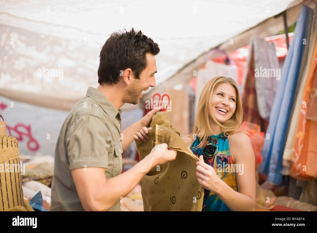 Men selling cloth Stock Photo - Alamy