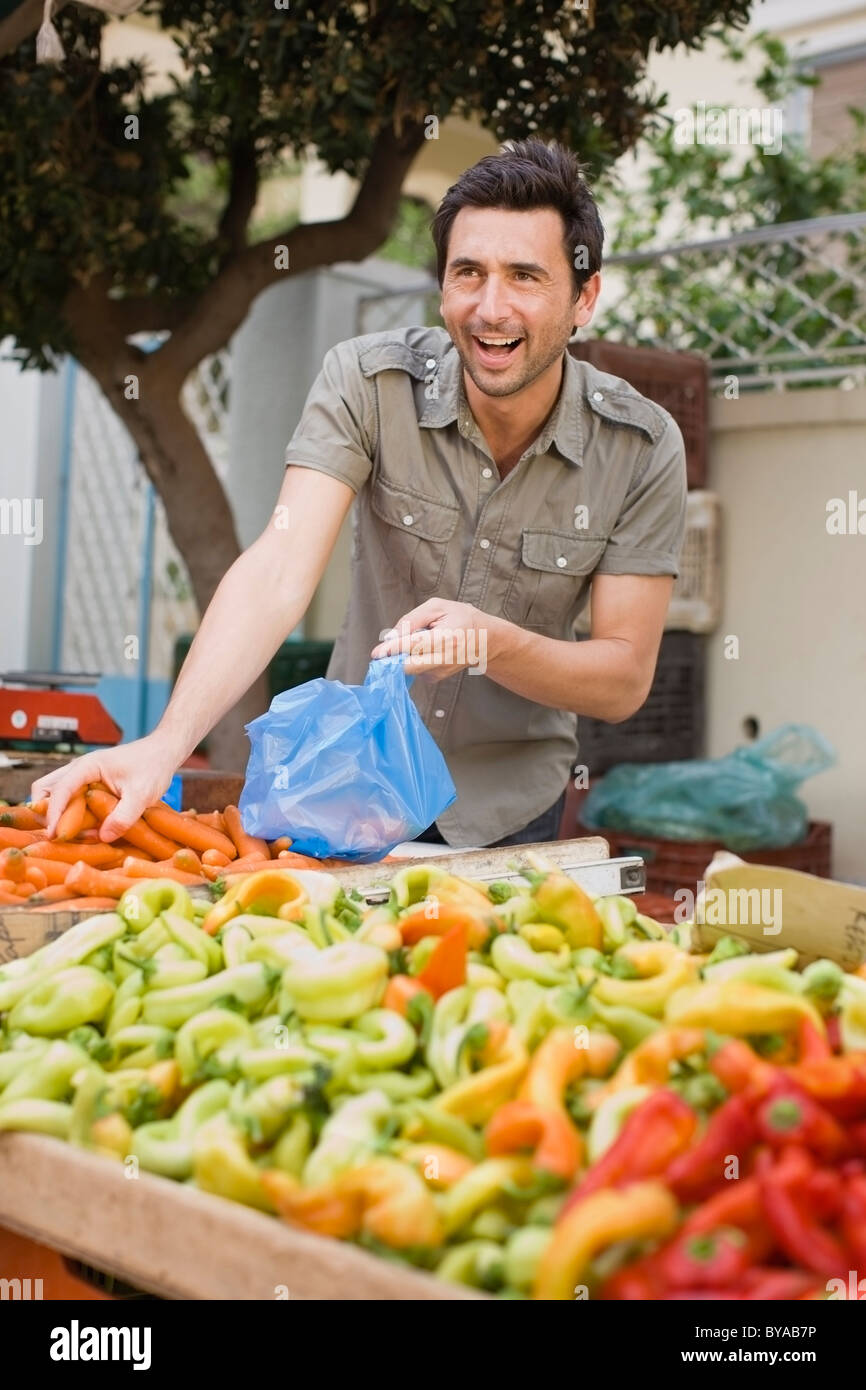Man selling vegetables Stock Photo - Alamy