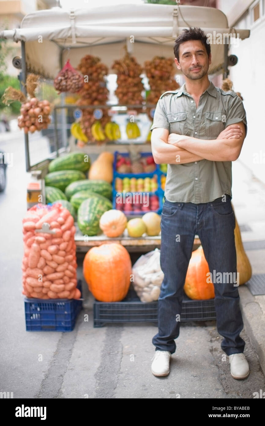 Man standing at market stall Stock Photo - Alamy