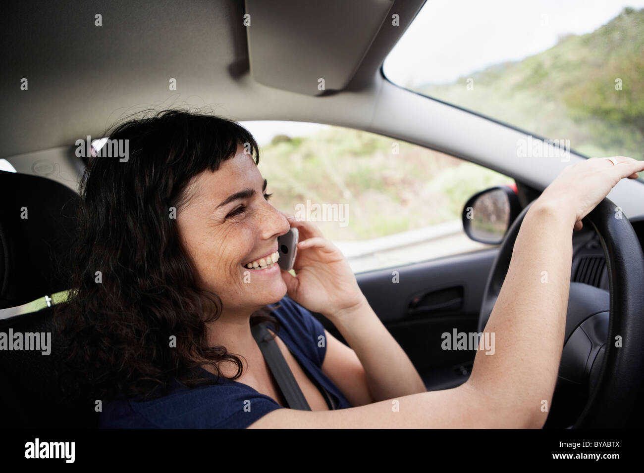Using mobile phone while driving hi-res stock photography and images ...