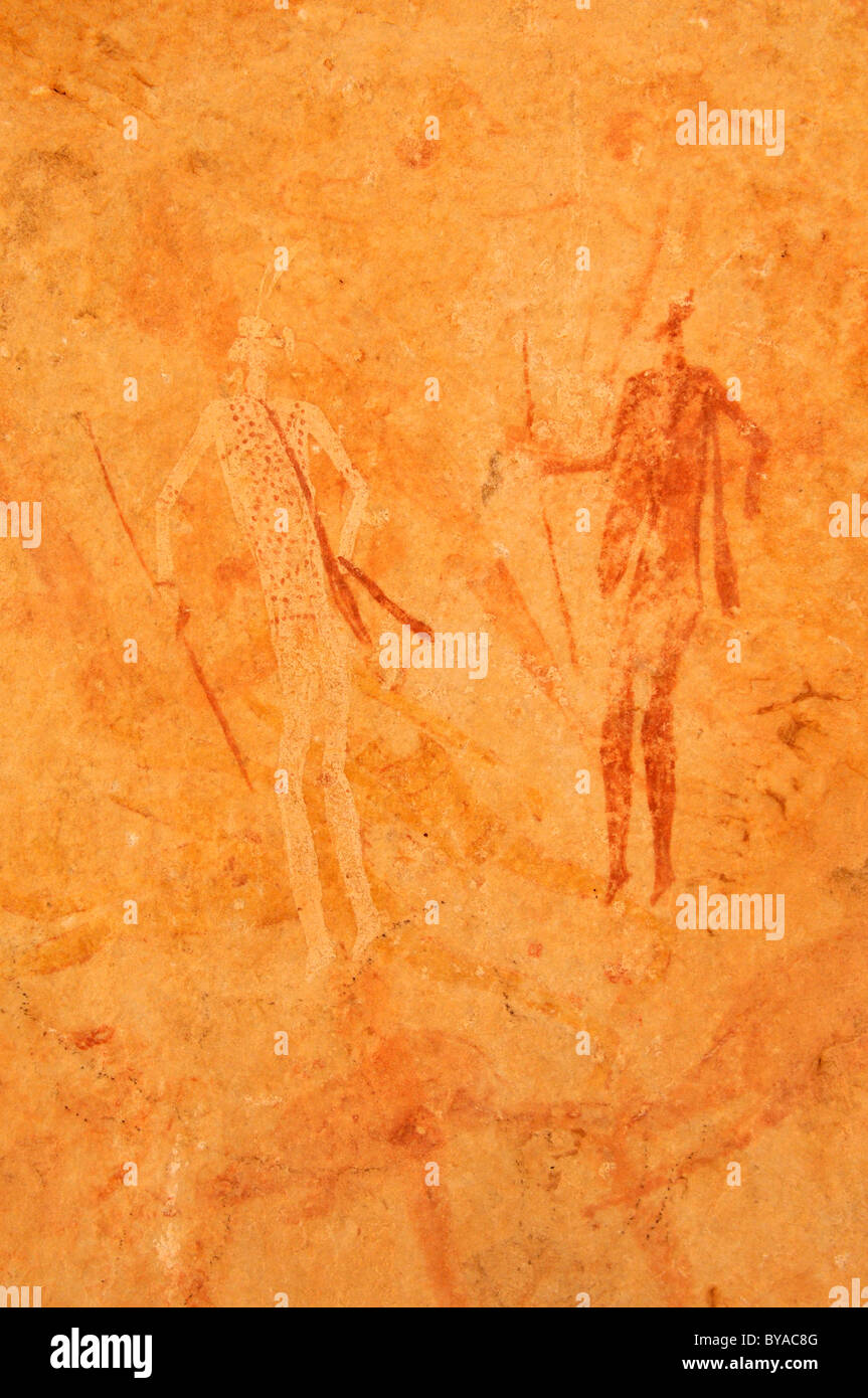 Neolithic rock art, painting of warriors, hunters with bow and arrow ...