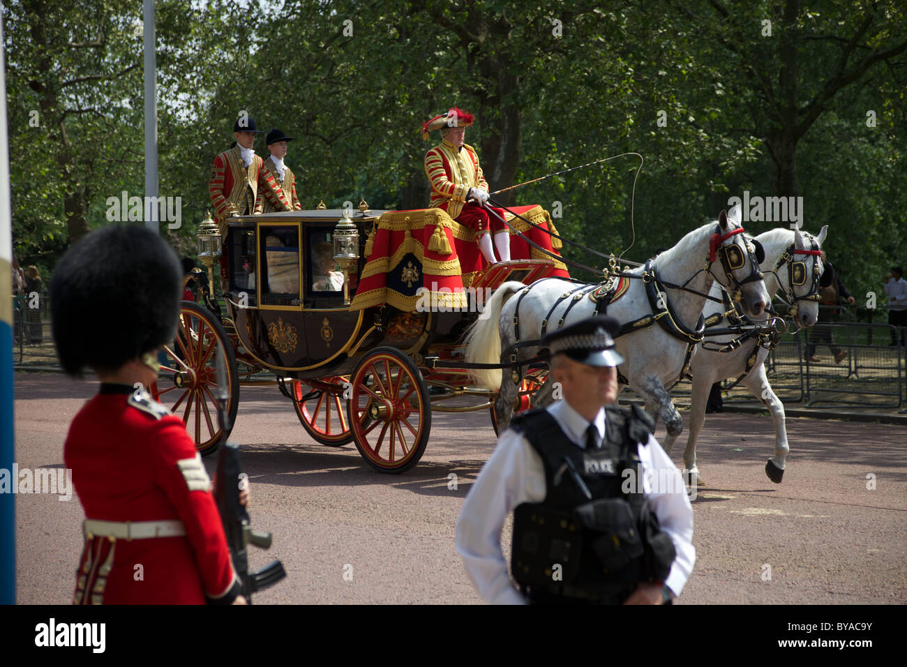 A Royal coach on the way to the State opening of Parliament, London ...
