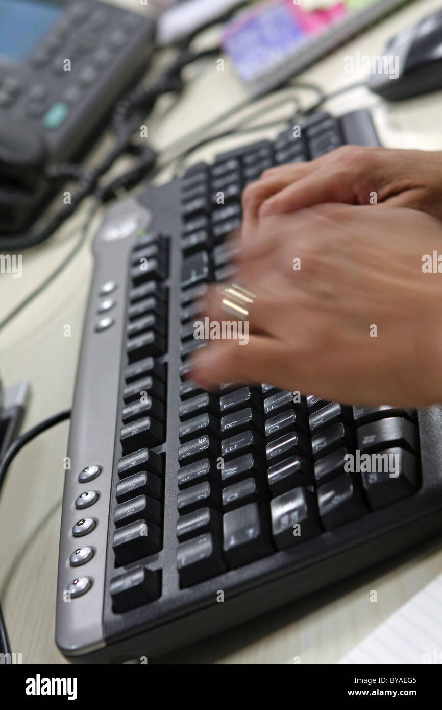 two female hands typing on a computer keyboard Stock Photo - Alamy