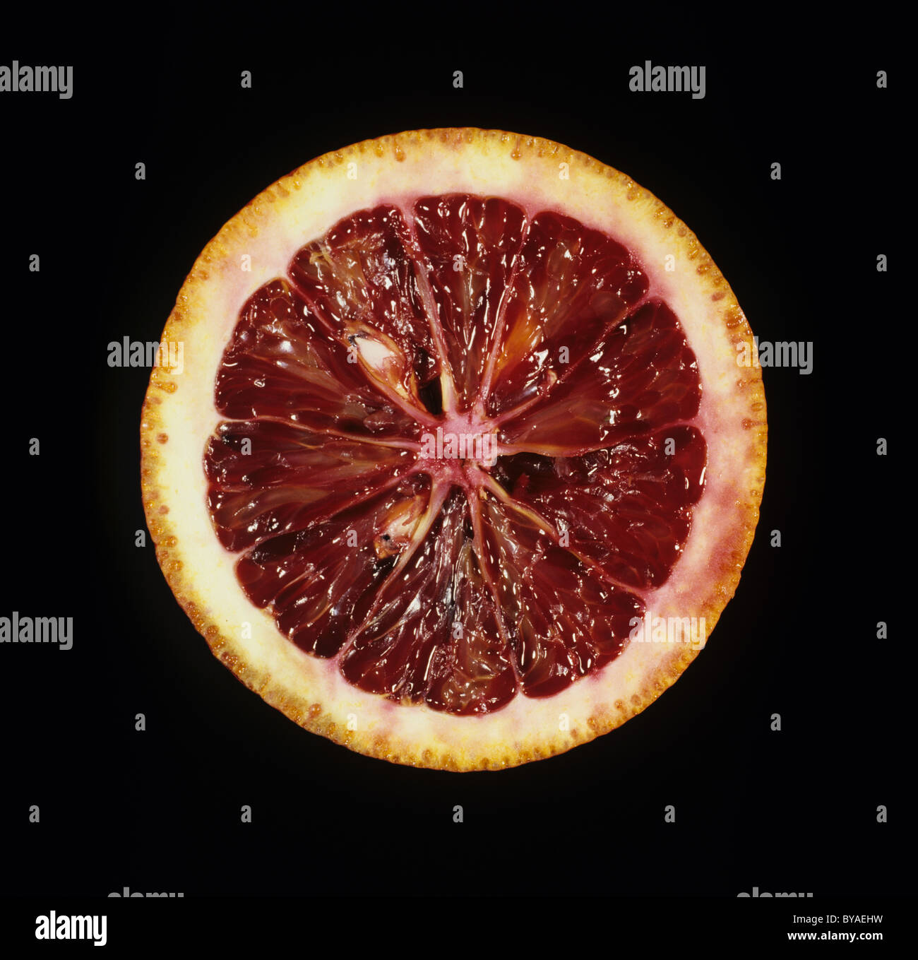 Section of cut blood orange fruit variety Moro Stock Photo - Alamy