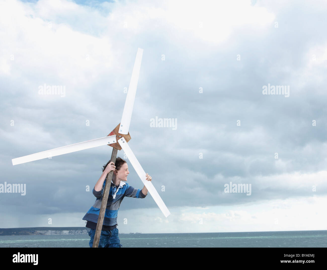 Boy with wind turbine Stock Photo - Alamy