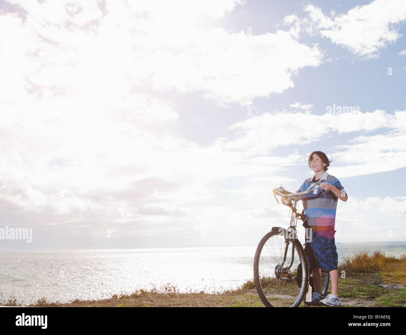 Boy with bicycle Stock Photo - Alamy