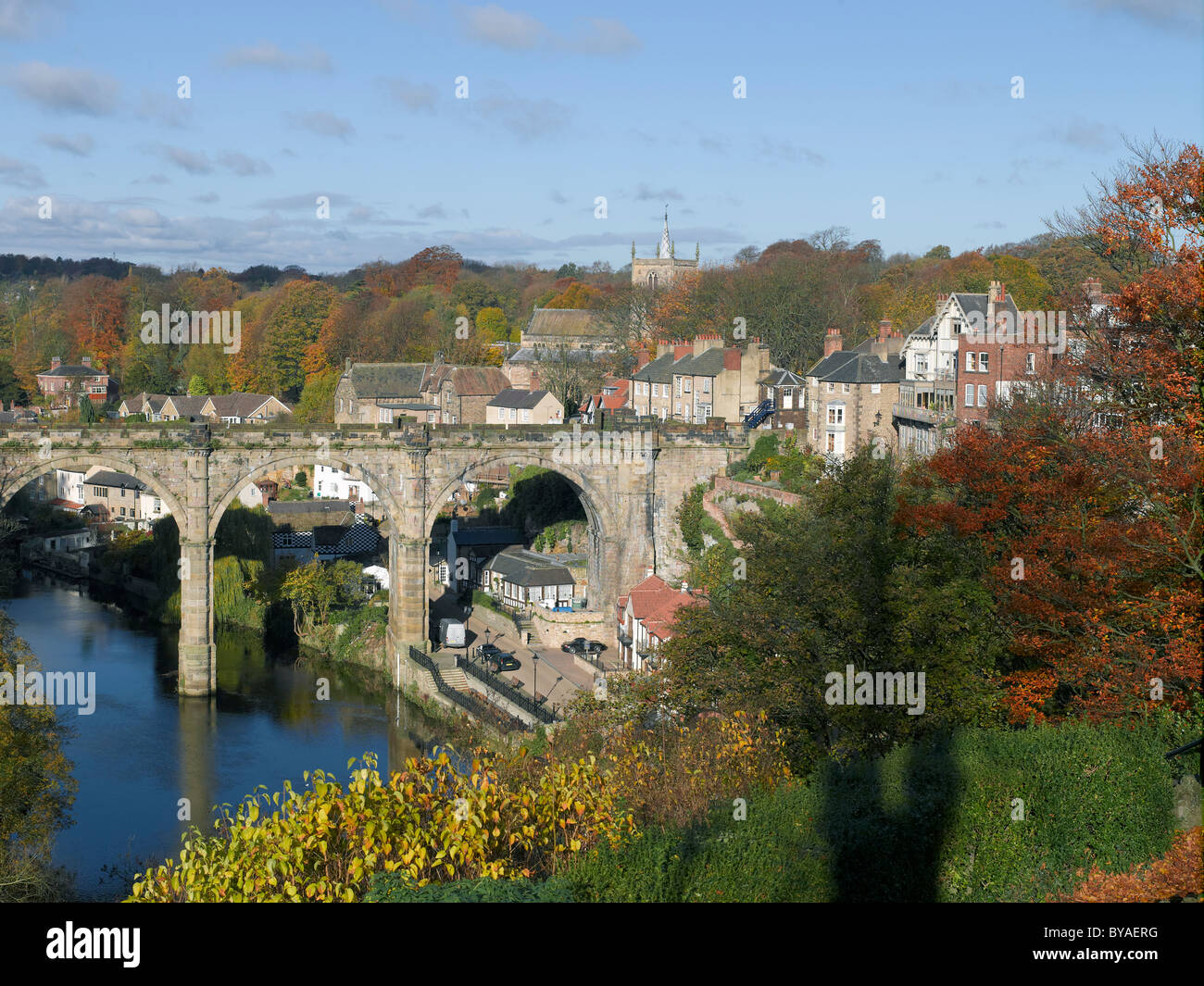 Railway train viaduct 1851 bridge across the River Nidd in autumn ...