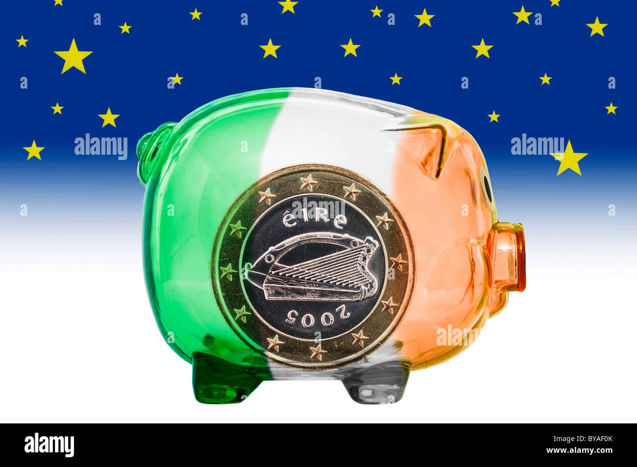 Irish one euro coin on a piggy bank coloured like the Irish national ...