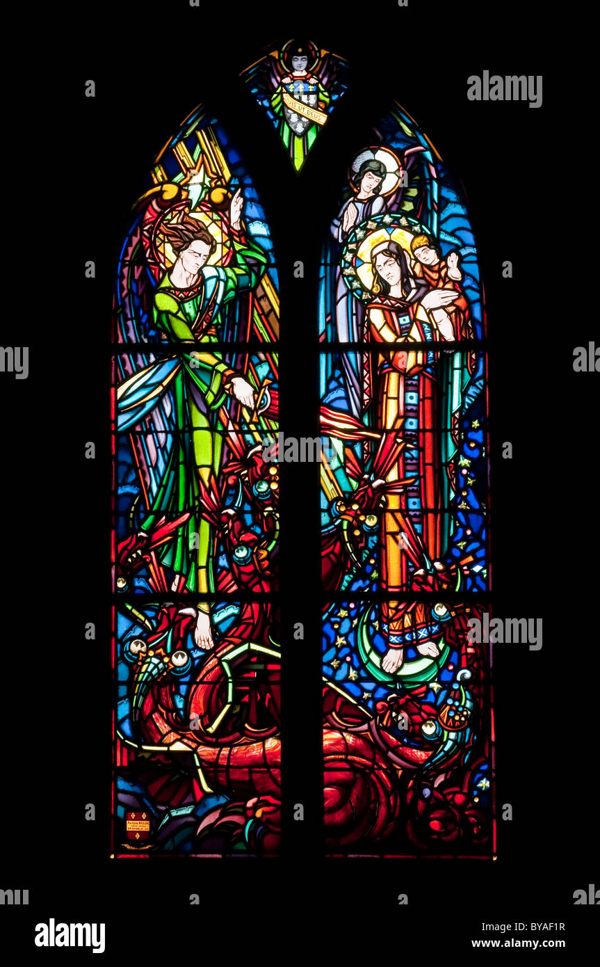 Stained-glass window picturing Saint Michael fighting dragon, the Mont ...