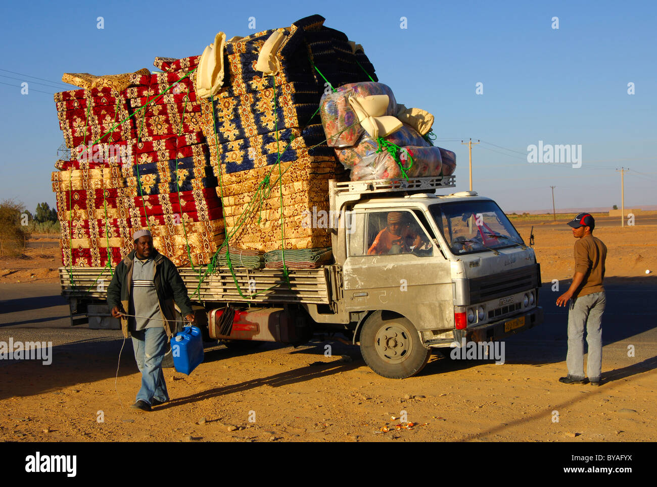 Transport truck carrying workers libya hi-res stock photography and ...