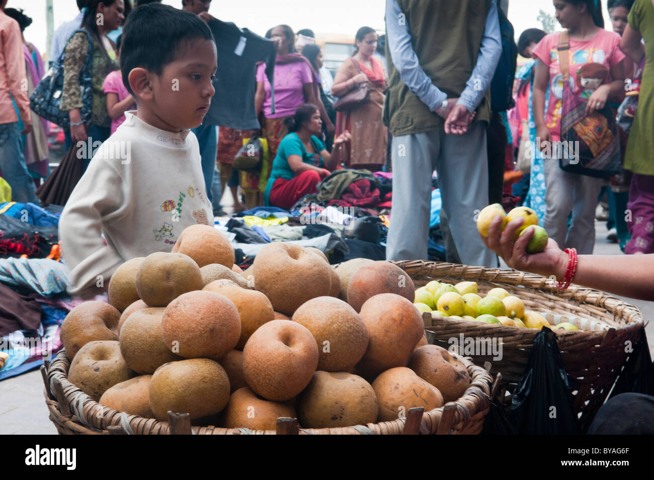 little boy and a pear vendor in Kathmandu, Nepal Stock Photo - Alamy