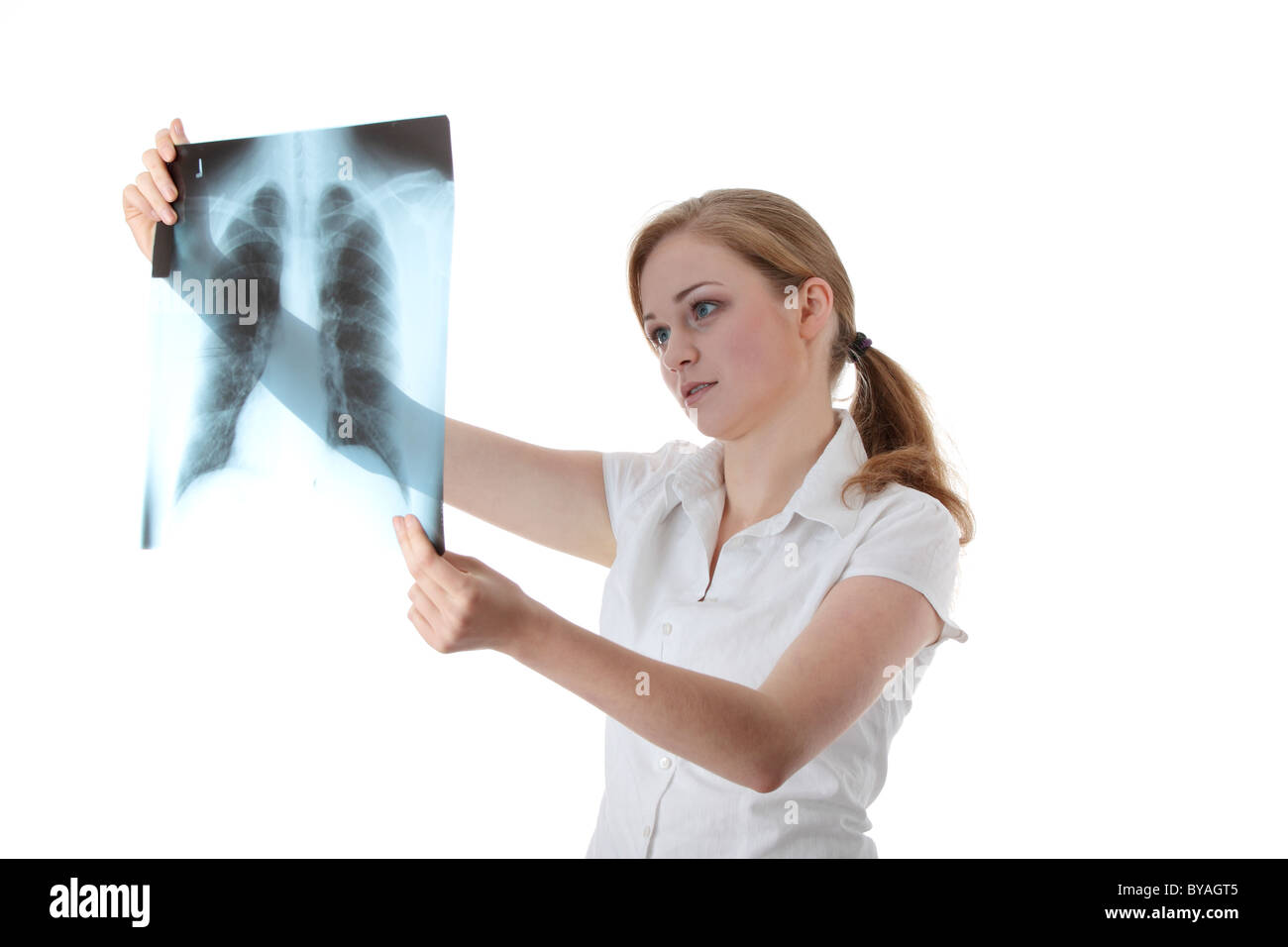 Female doctor examining a chest x-ray photo scan. Isolated on white ...