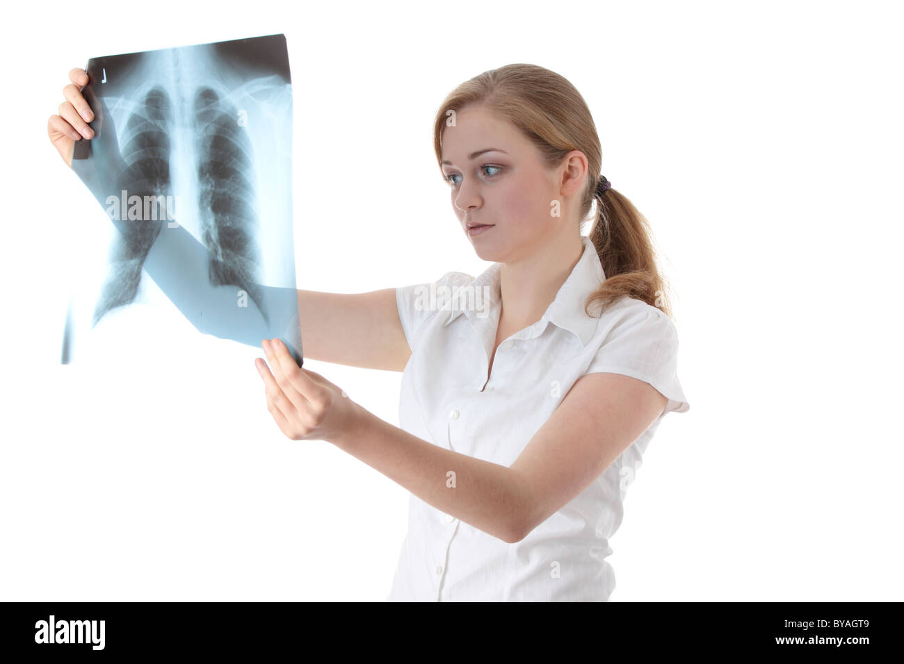 Female doctor examining a chest x-ray photo scan. Isolated on white ...