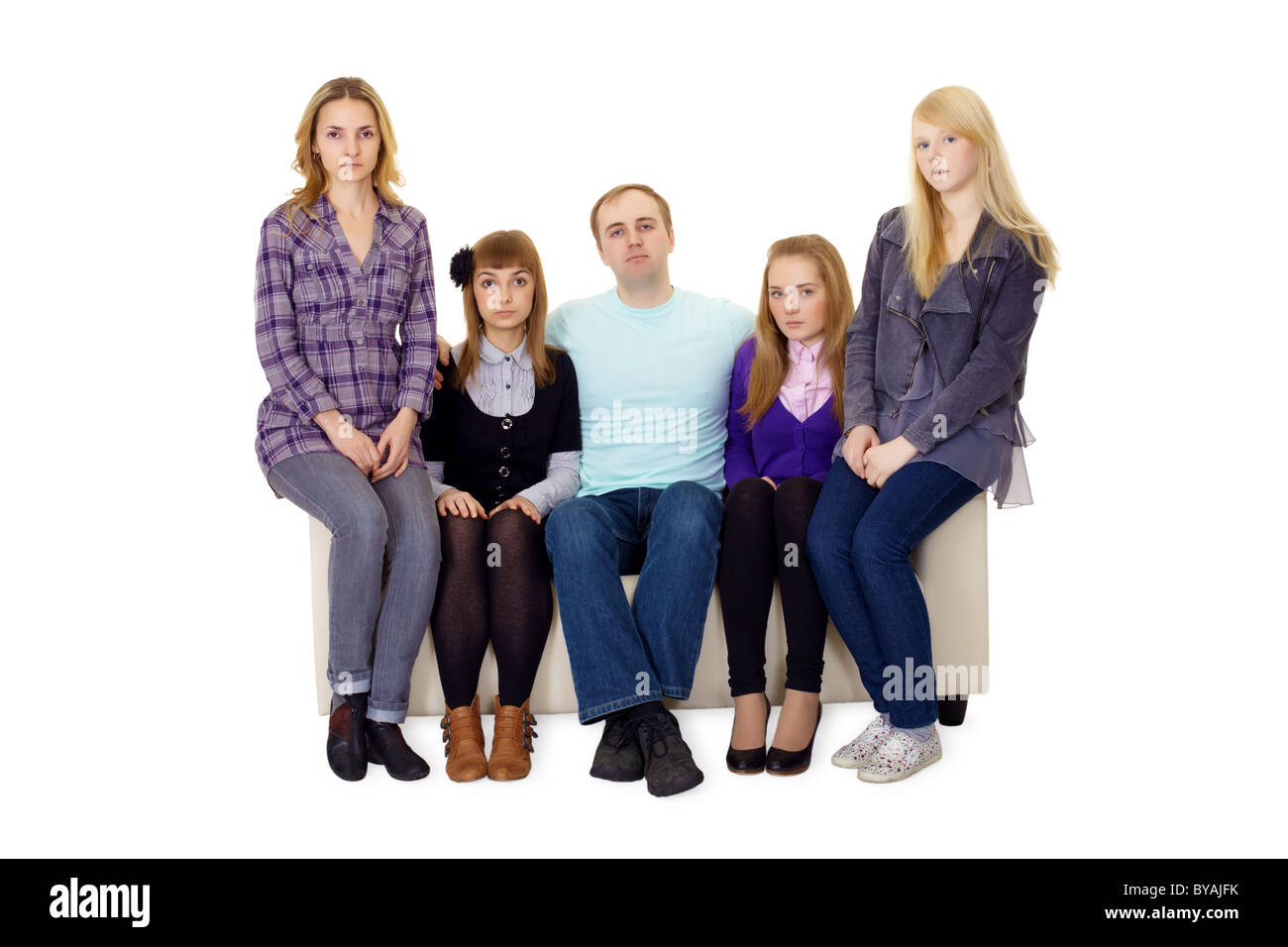 An ordinary family with many children sitting on the couch Stock Photo ...