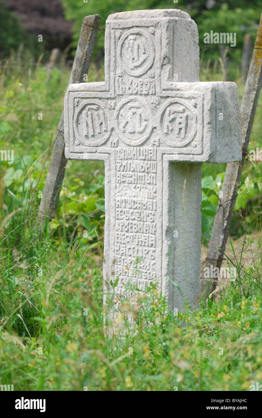 ancient cross stone in the middle of green nature Stock Photo - Alamy