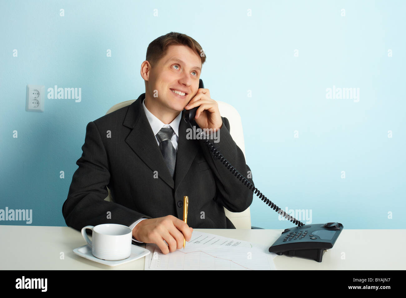 Business man talking on the phone in the office Stock Photo - Alamy