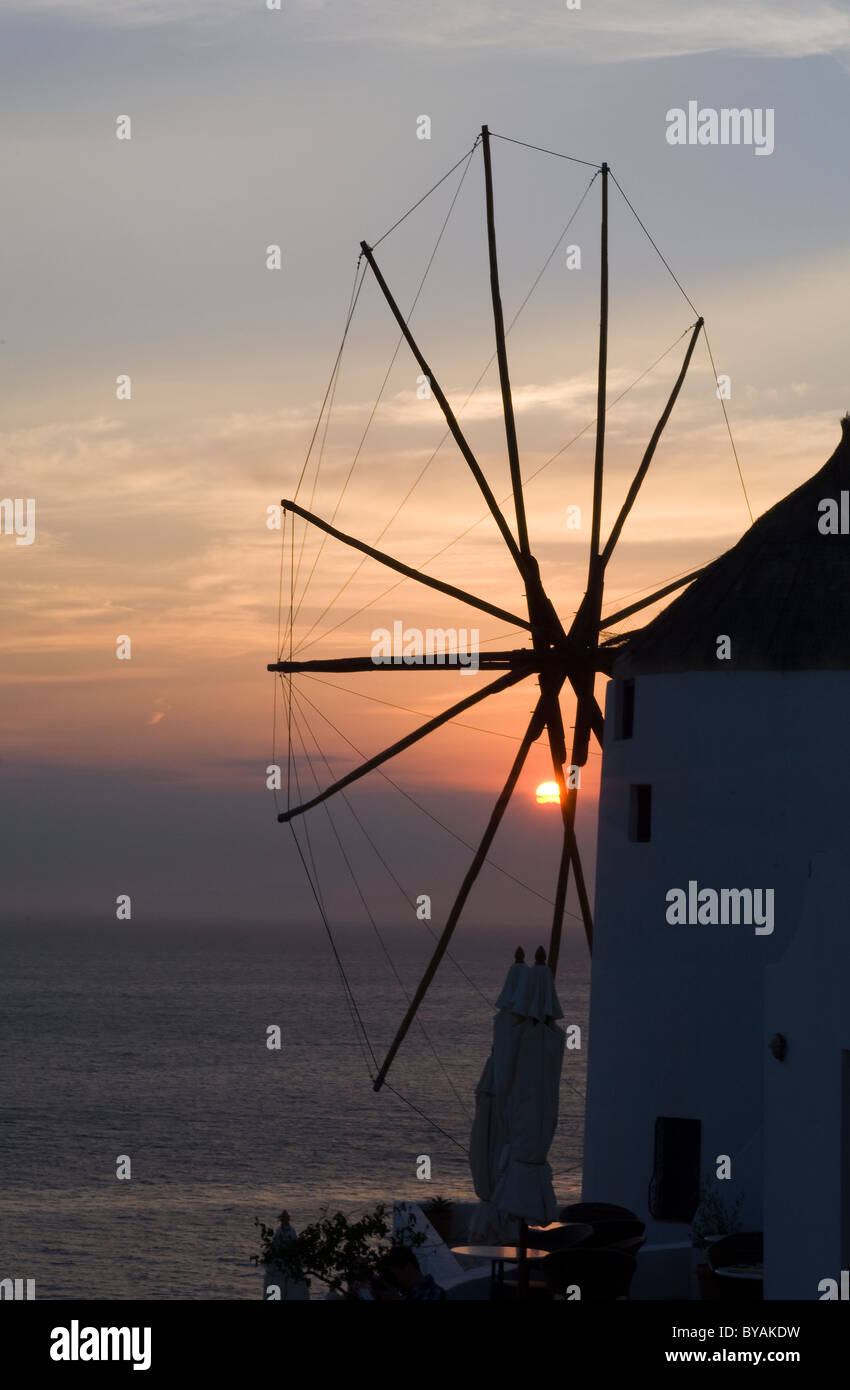 The landmark windmill in Oia, Santorini as sunset approaches Stock ...