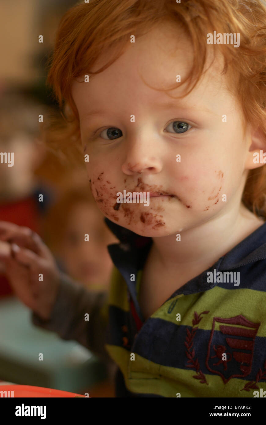 Young boy with messy face Stock Photo - Alamy