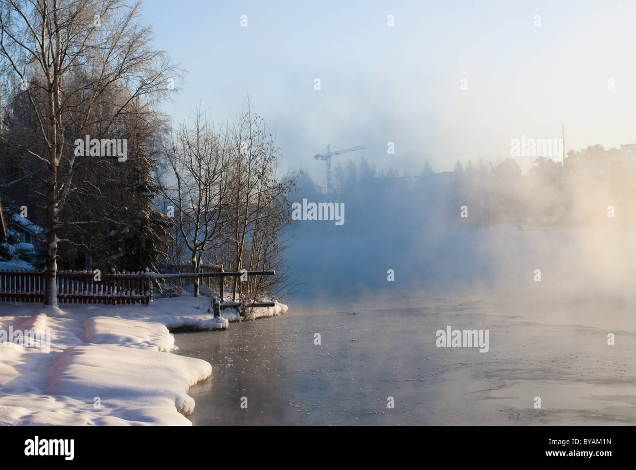 Mist rising from the river Oulu in a cold winter day in Oulu, Finland ...