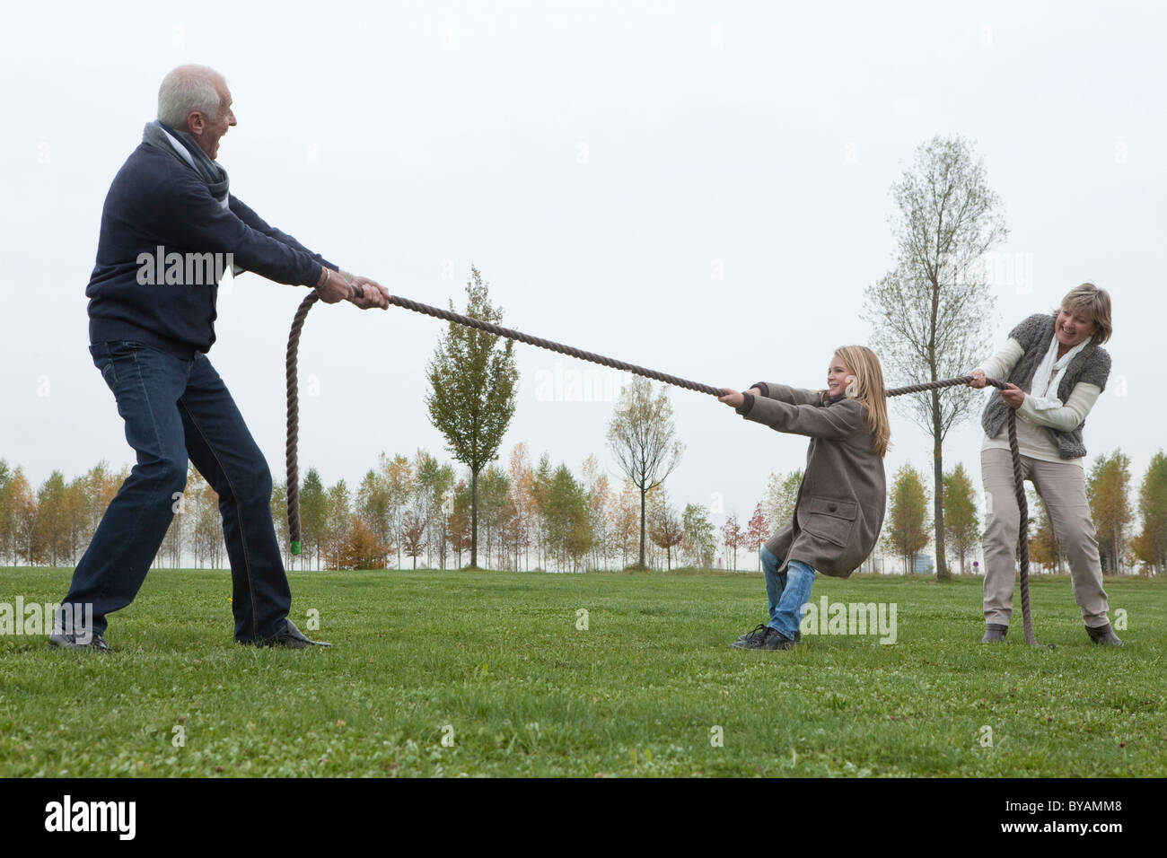 Girl playing tug war hi-res stock photography and images - Alamy