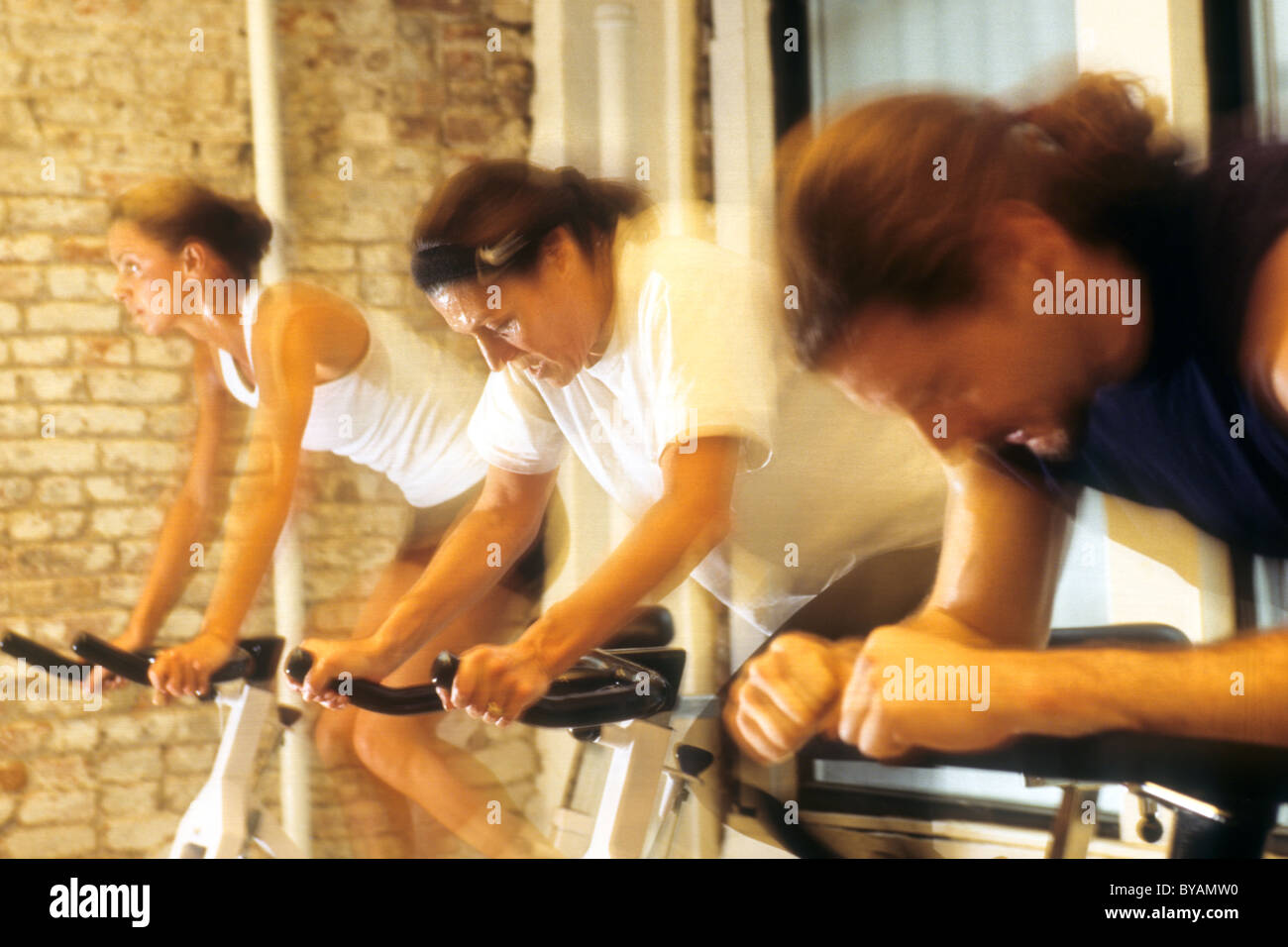 Cycling spinning class in action Stock Photo - Alamy
