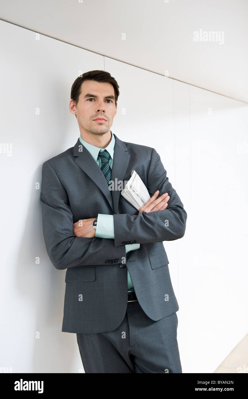 Man waiting with newspaper Stock Photo - Alamy