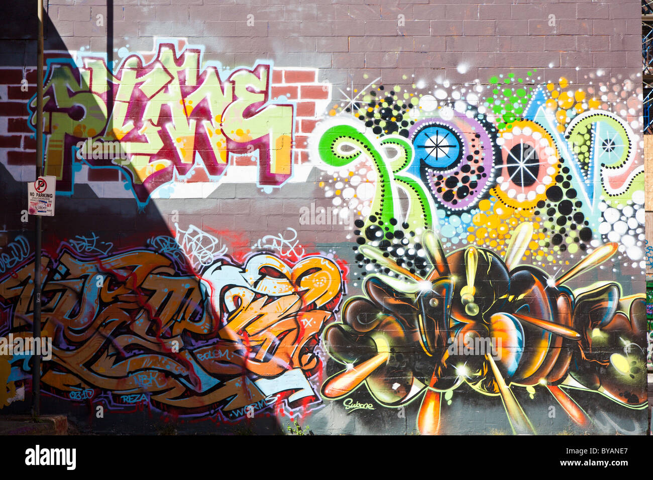 Brick wall brightly painted with graffiti in Portland, Maine Stock ...