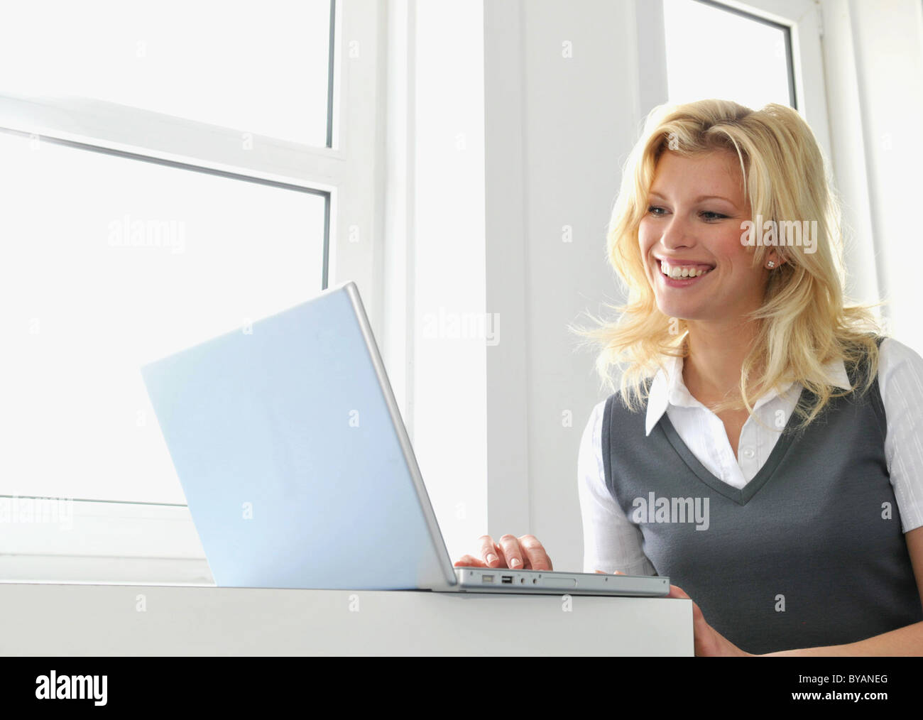 Happy business women at work Stock Photo - Alamy