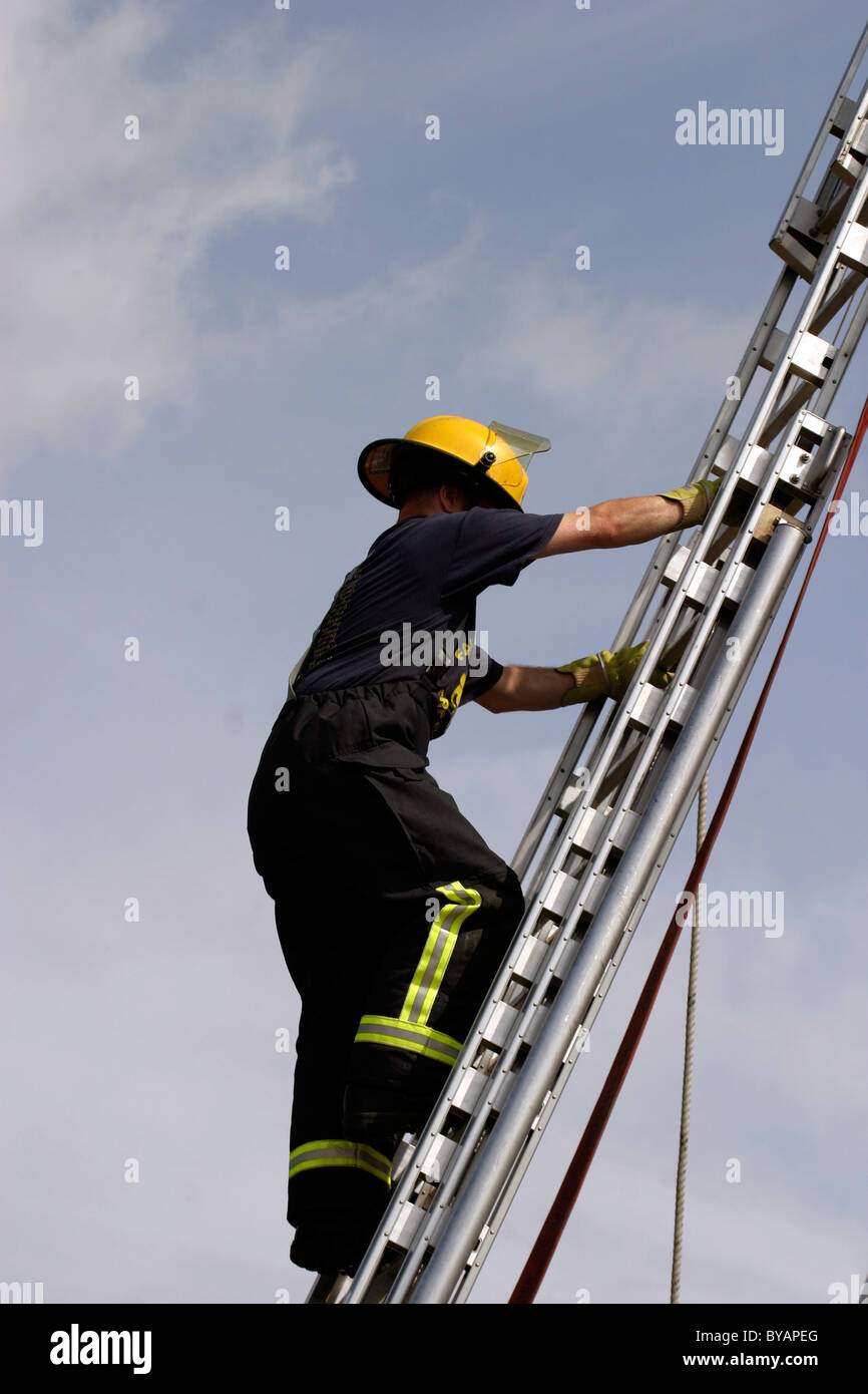 Fireman Climbing A Ladder High Resolution Stock Photography and Images ...