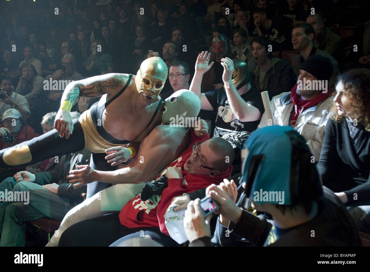 Luchador (Mexican wrestler) jumping on his opponent during a exhibition ...
