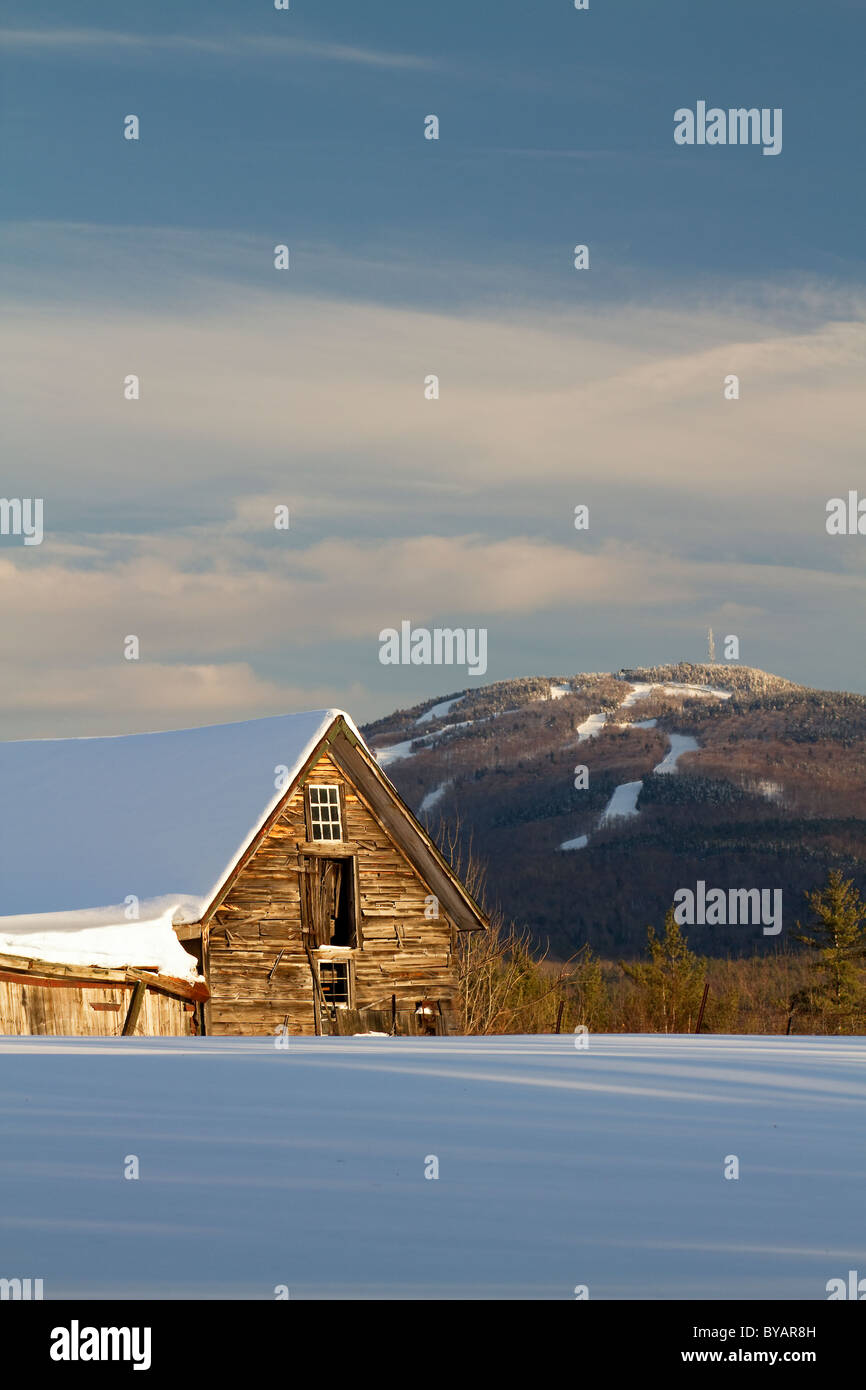 A scenic New Hampshire winter landscape with snow and barn and Mount ...