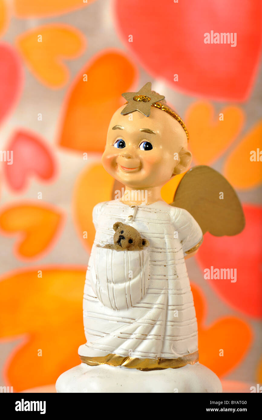 Cheeky angel figure Stock Photo - Alamy