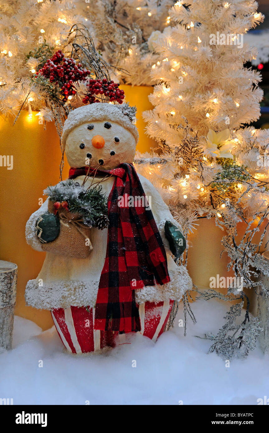 Christmas decorations, snowman in front of a Christmas tree Stock Photo ...