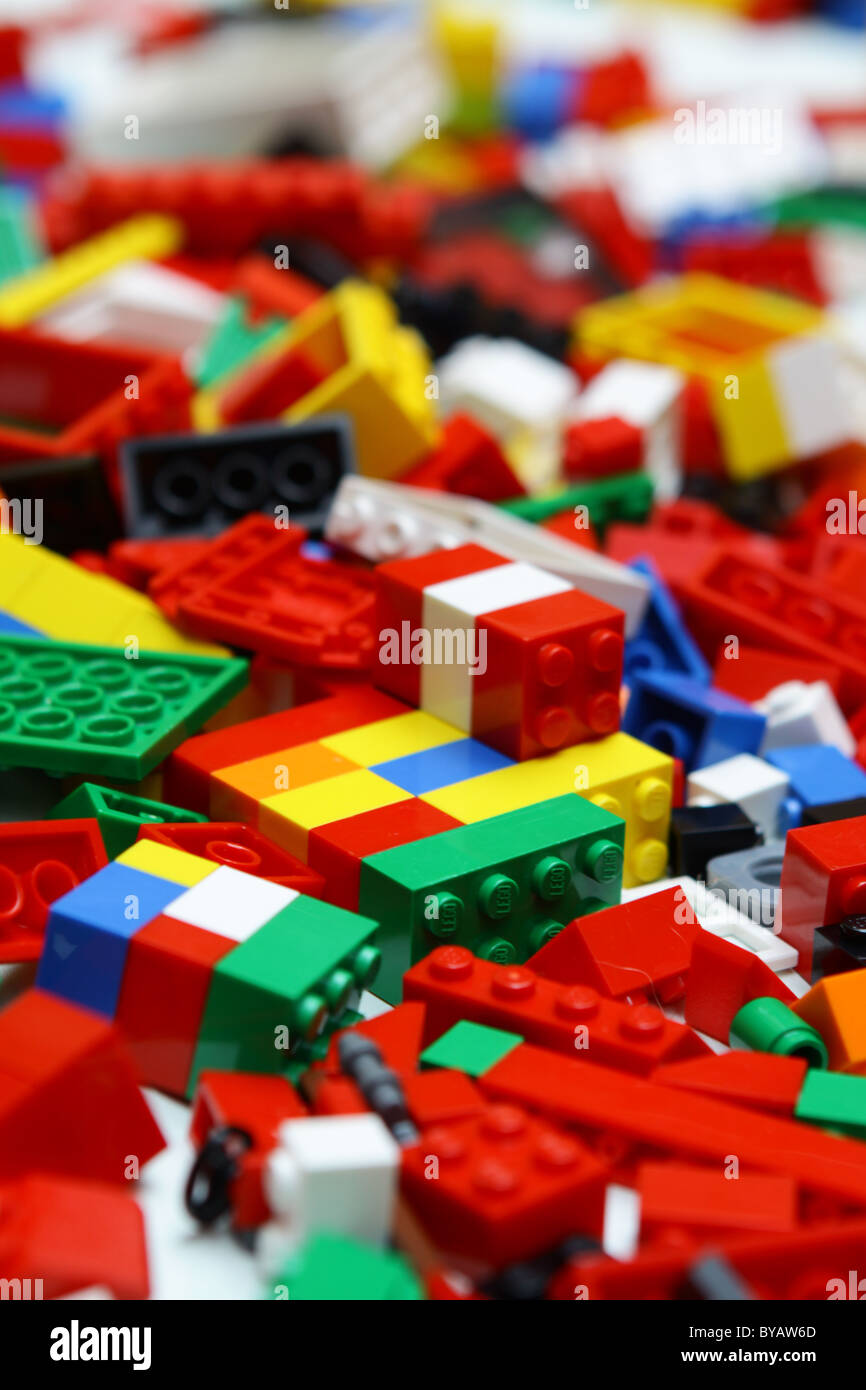 Lego pieces spread on and around floor Stock Photo - Alamy