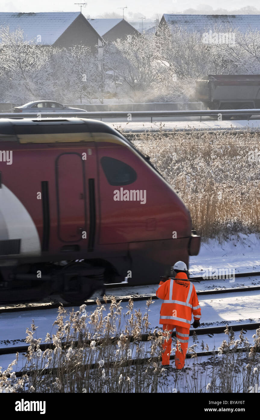 Railway line workers in winter track inspection Stock Photo - Alamy
