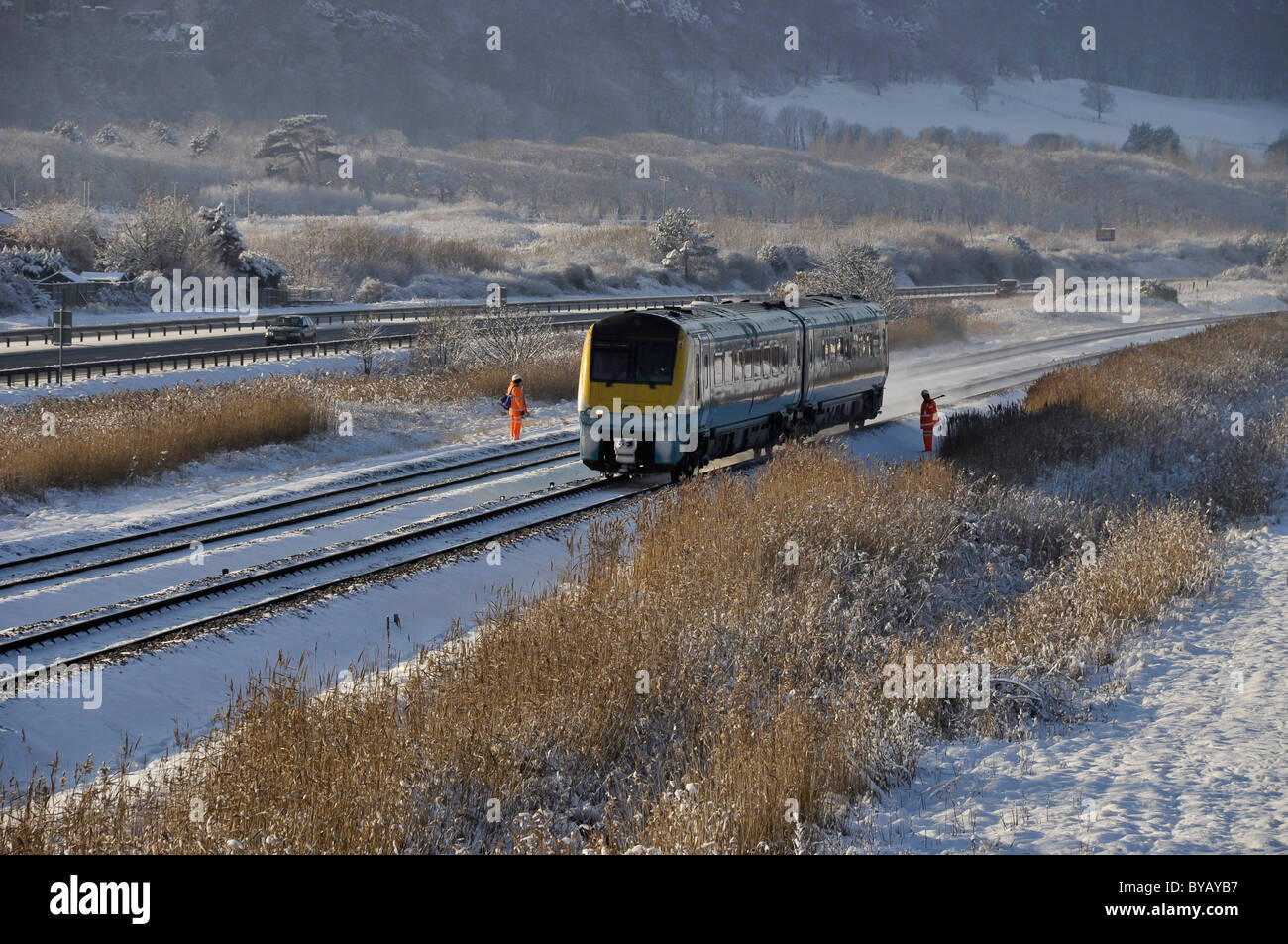 Railway line workers in winter track inspection Stock Photo - Alamy