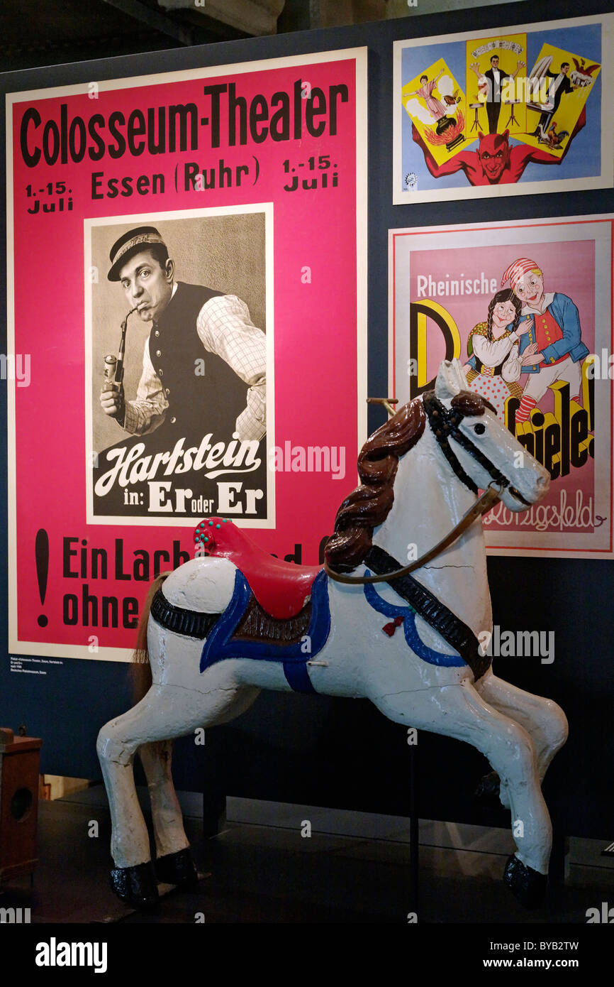 Historic poster of the Colosseum Theater Essen and a carousel horse ...