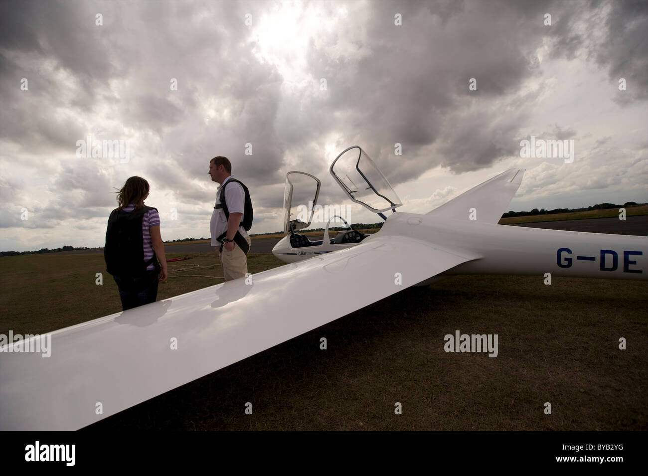 Two pilots standing in front of their glider before they take off Stock ...