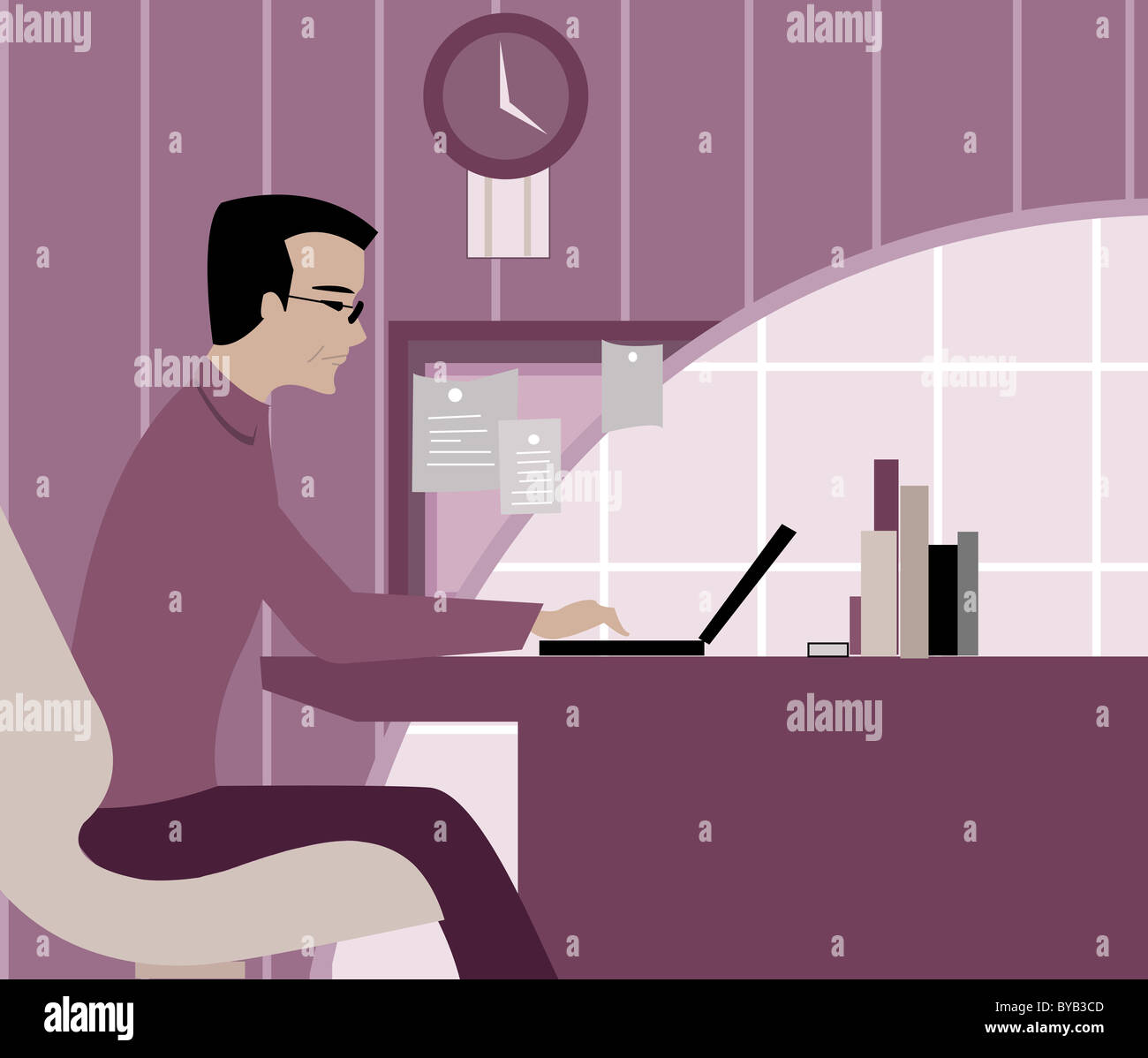 A man working on his laptop computer Stock Photo - Alamy