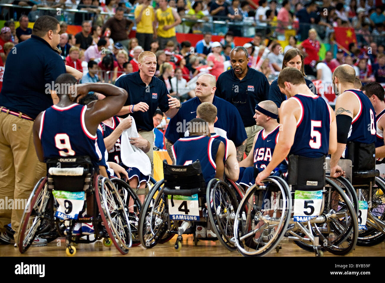 US coach gives his team a pep-talk during a time-out in the semi-final ...
