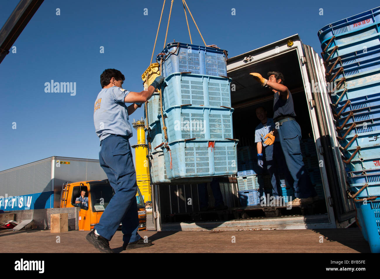 Crates full of crab are loaded into a truck at the port of Wakkanai ...