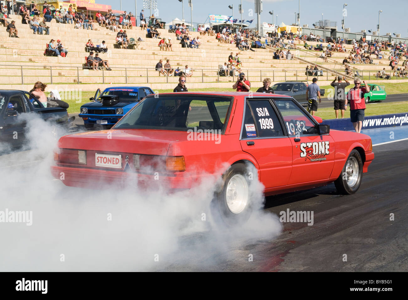 Australian Ford drag racing car performing a burnout prior to racing on ...