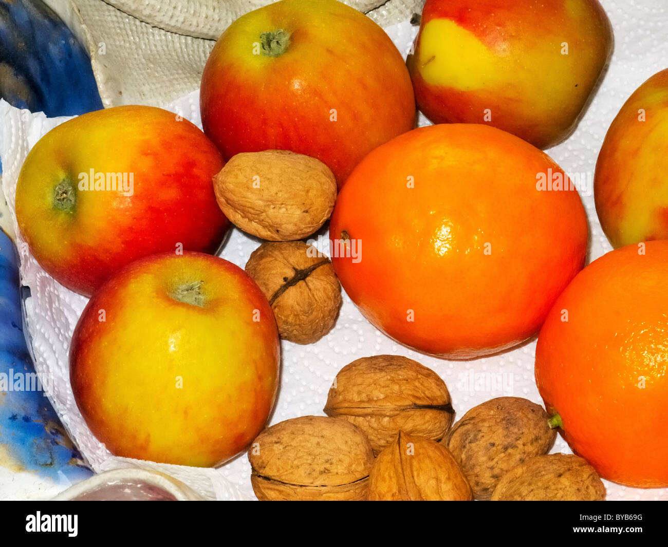 Winter fruit mix with apples, oranges and walnuts Stock Photo - Alamy