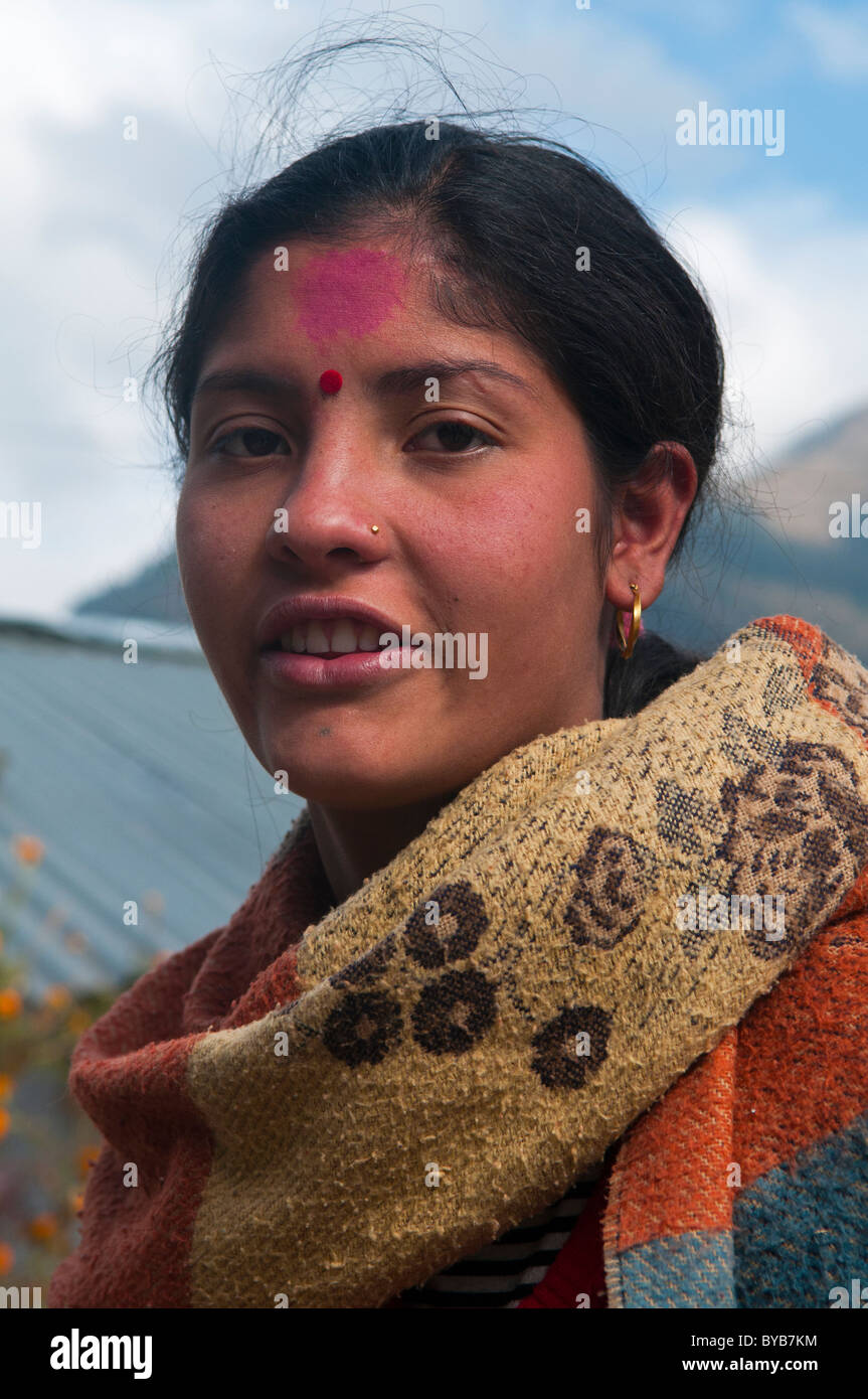Nepali girl and her basket in the Annapurna region of Nepal Stock Photo ...