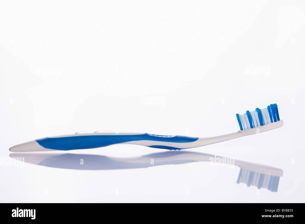 Blue and white toothbrush Stock Photo - Alamy