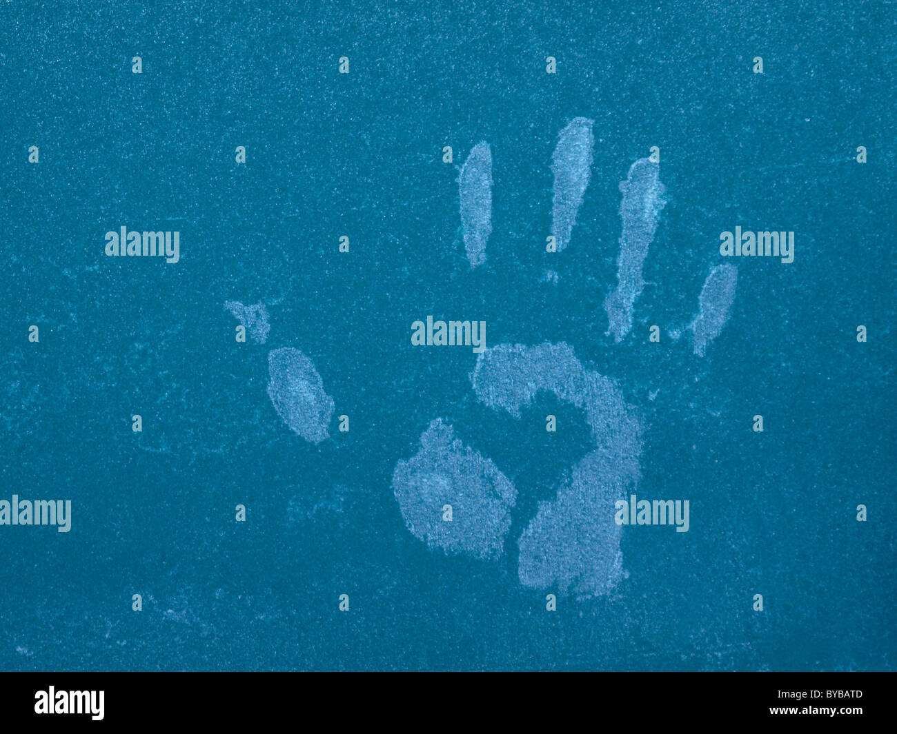 Hand print on a frozen window Stock Photo - Alamy